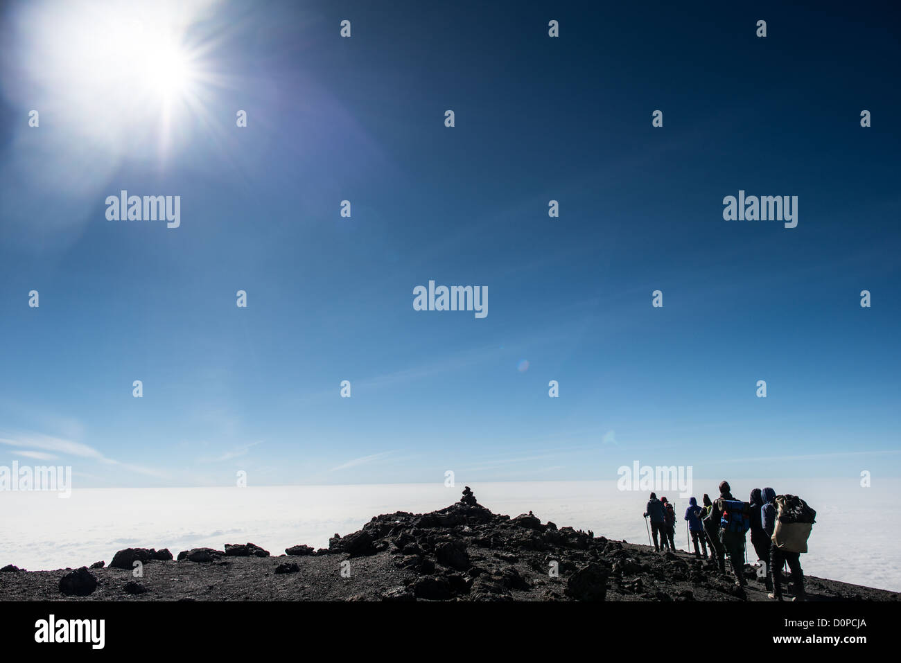 MOUNT KILIMANJARO, Tanzania — A group of climbers hike on the summit of Mt. Kilimanjaro (Kibo ...