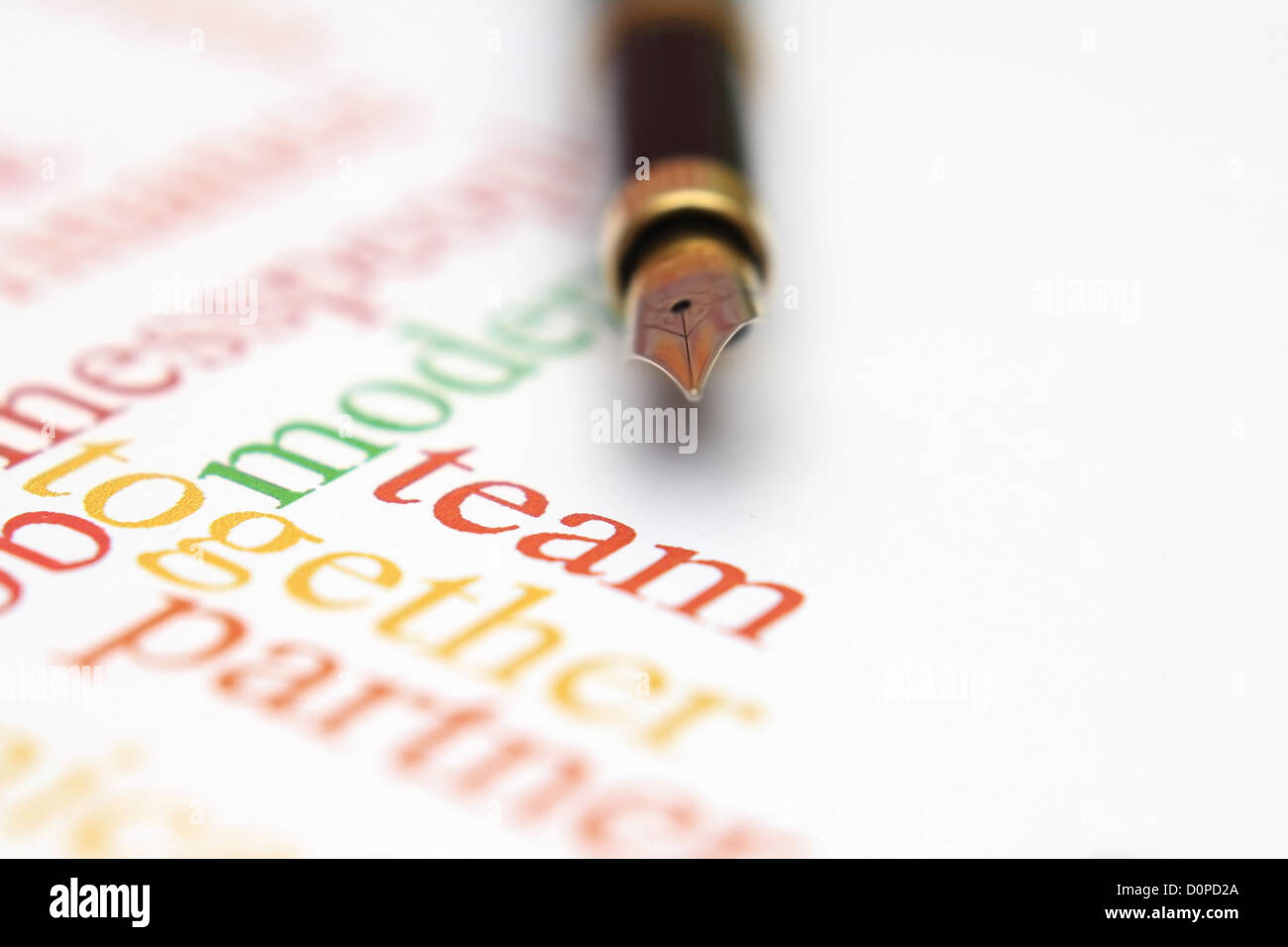 Pen on team text Stock Photo - Alamy