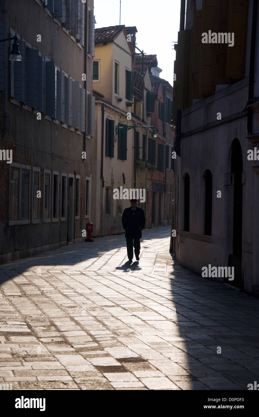 Man walking in lane Stock Photo - Alamy
