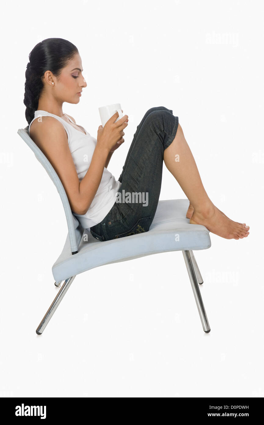 Indian woman drinking tea Cut Out Stock Images & Pictures - Alamy