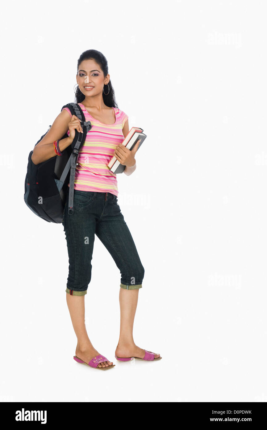 Portrait of a university student carrying a bag and books Stock Photo ...