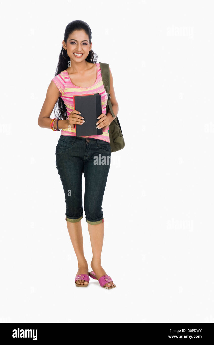 Portrait of a university student carrying a bag and books Stock Photo ...