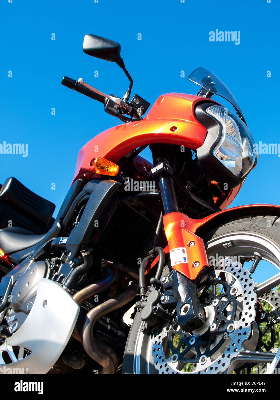 orange motorbike and a blue sky Stock Photo - Alamy