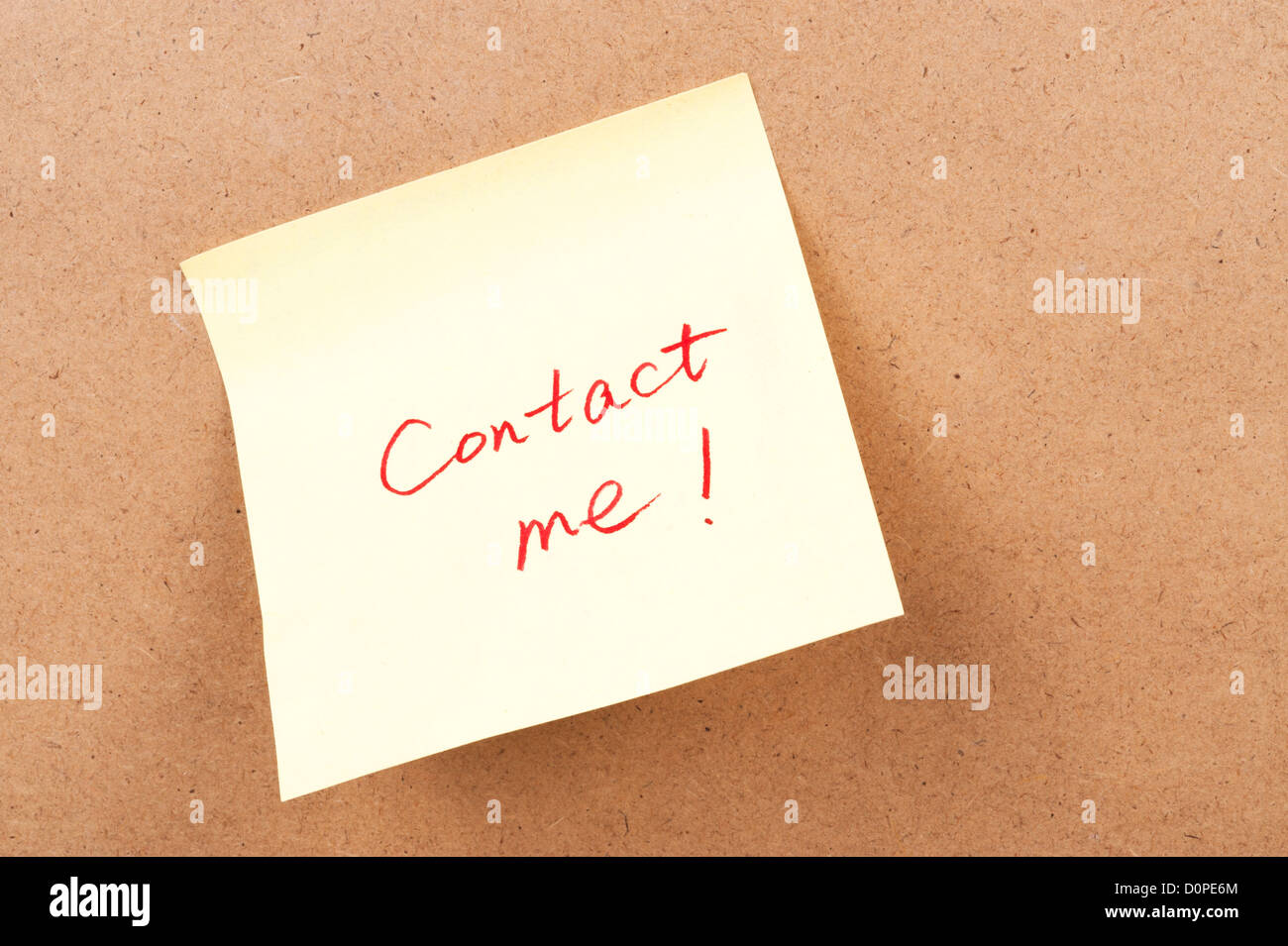 Contact me words written on a sticky note Stock Photo - Alamy