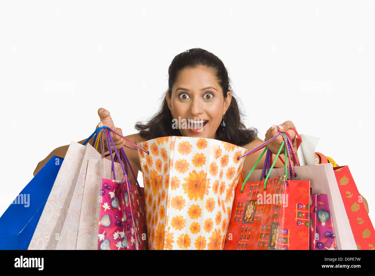 Portrait of a woman carrying shopping bags Stock Photo - Alamy