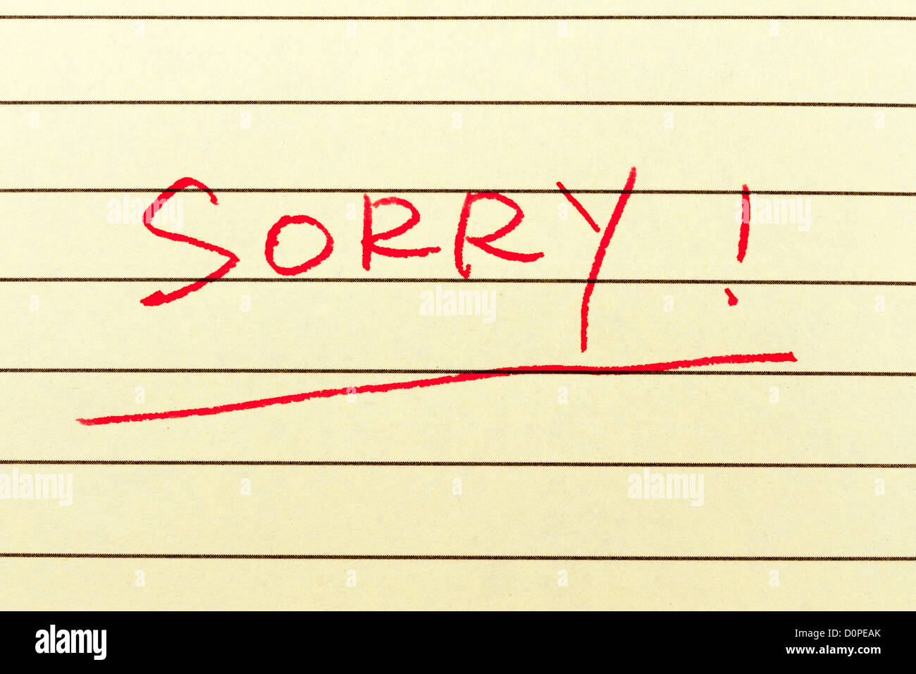 Sorry word written on the paper Stock Photo - Alamy