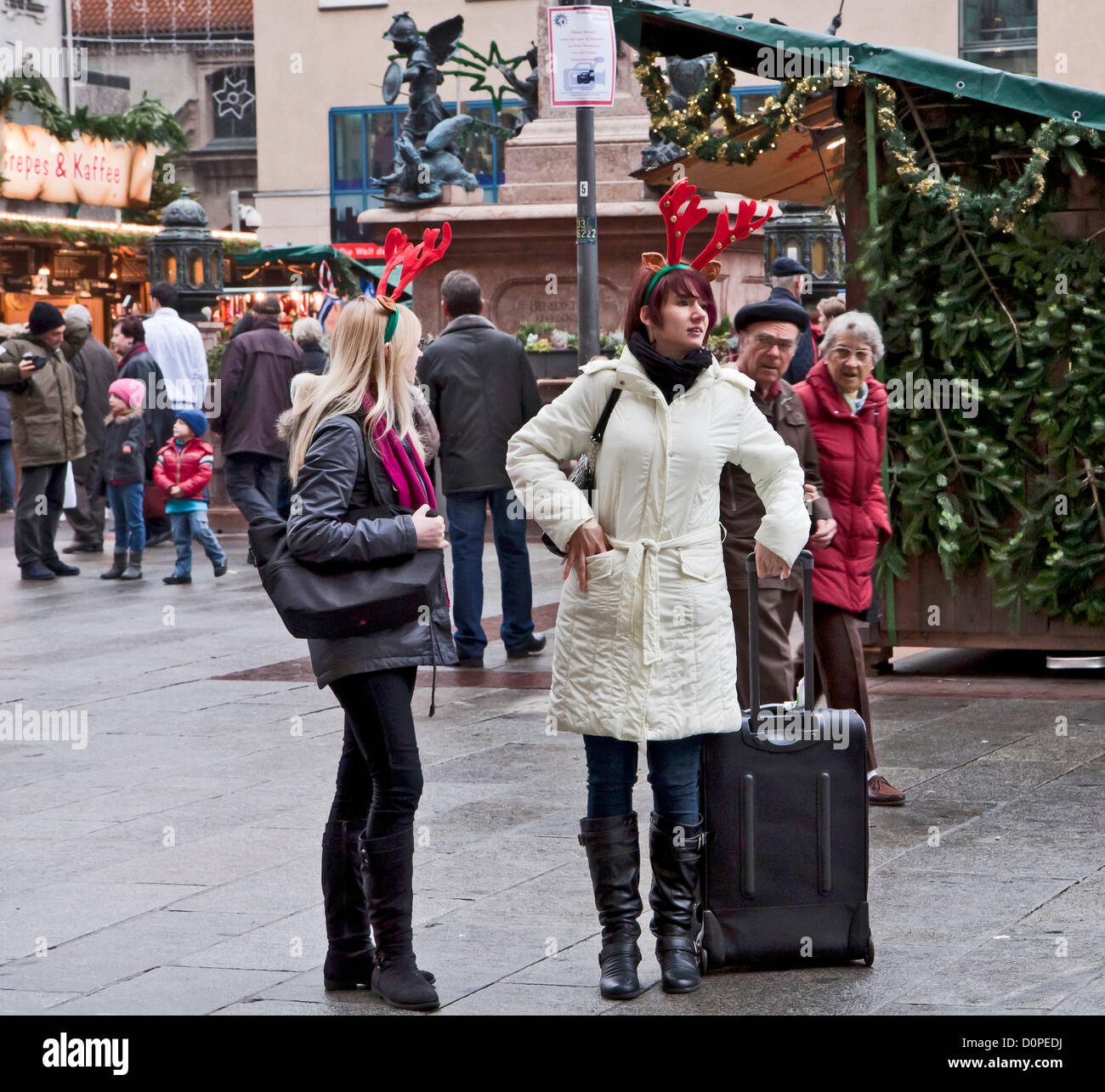 Munich, Germany November 28th, 2012.Two girls looking around at ...