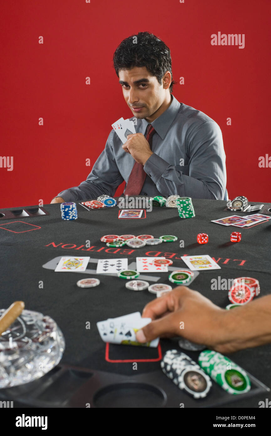 Portrait of a man gambling in a casino Stock Photo - Alamy