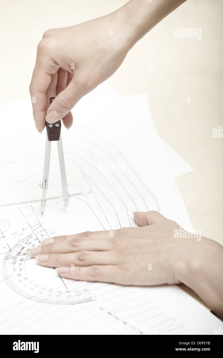 Hands of engineer working on a construction plan Stock Photo - Alamy