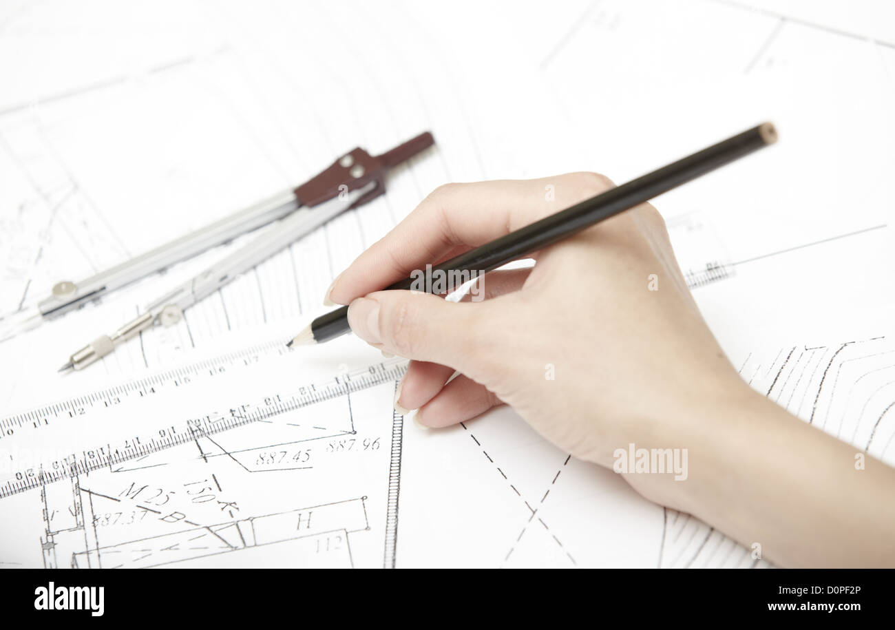 Hand of engineer working on a construction plan Stock Photo - Alamy