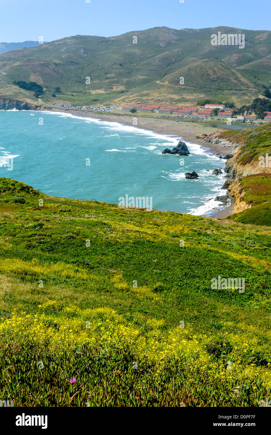 View on the beach, meadow and mountains Stock Photo - Alamy