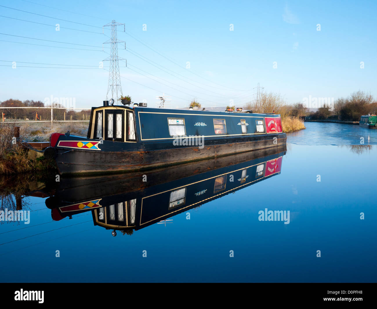Barge moored up in winter on the Rochdale Canal at Slattocks, Middleton ...
