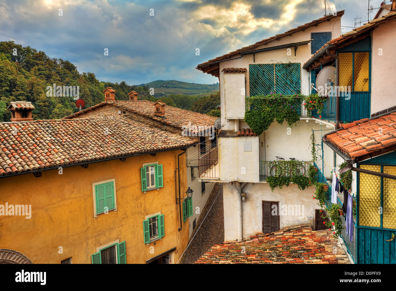 Fragment of small italian town with colorful houses, roofs covered by ...