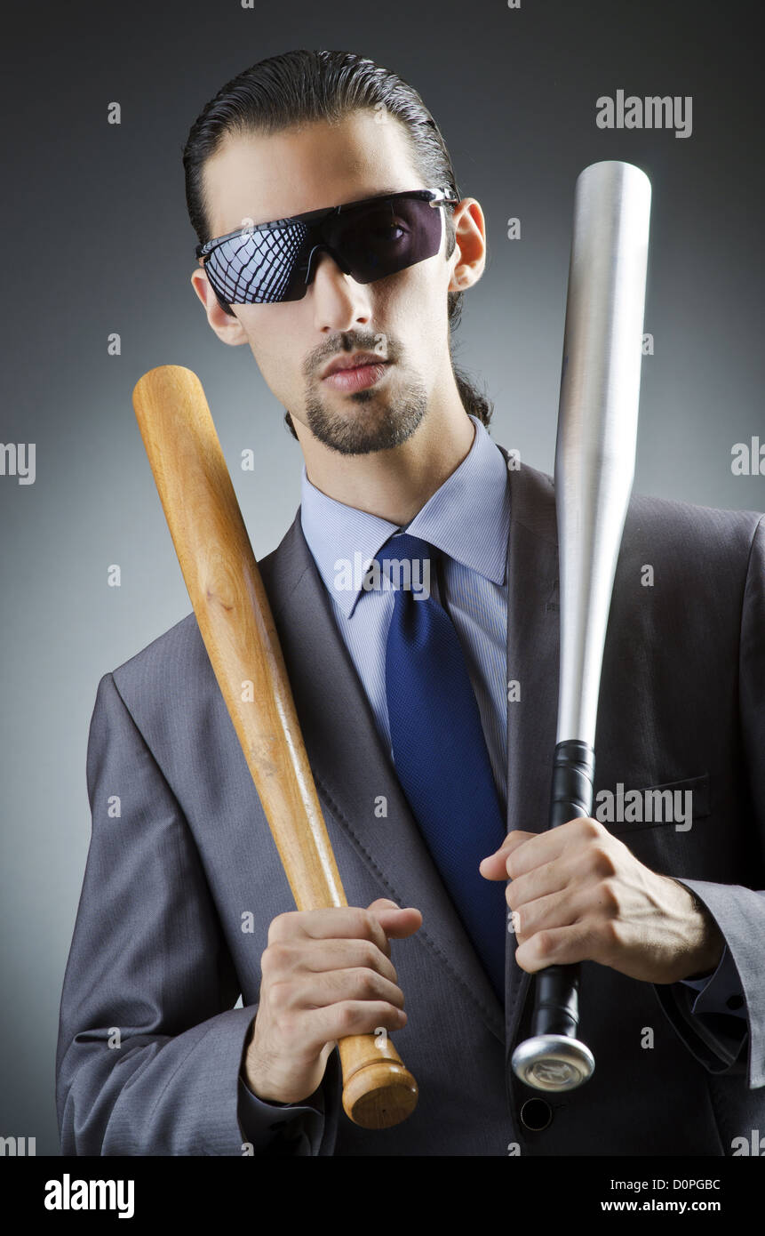 Angry businessman with bat on white Stock Photo - Alamy