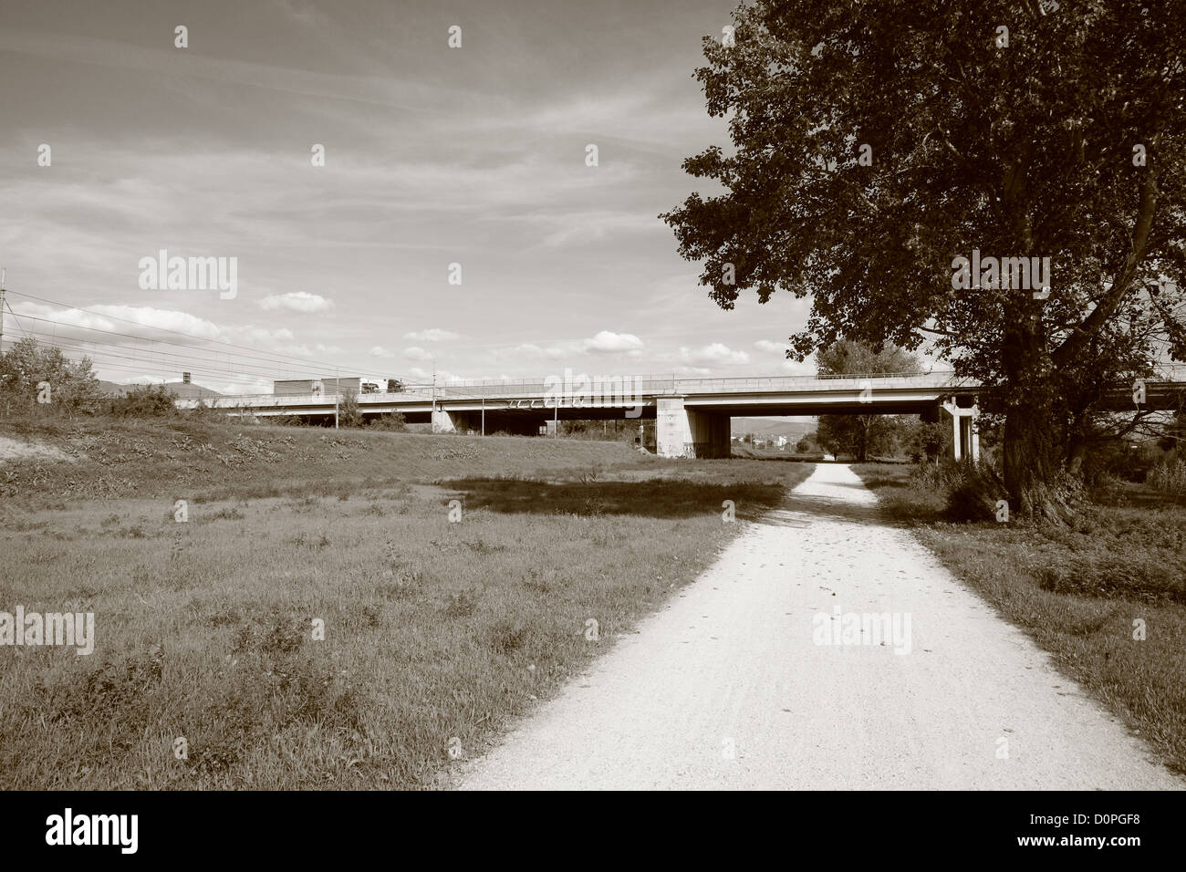 Dirt road to the city Stock Photo - Alamy