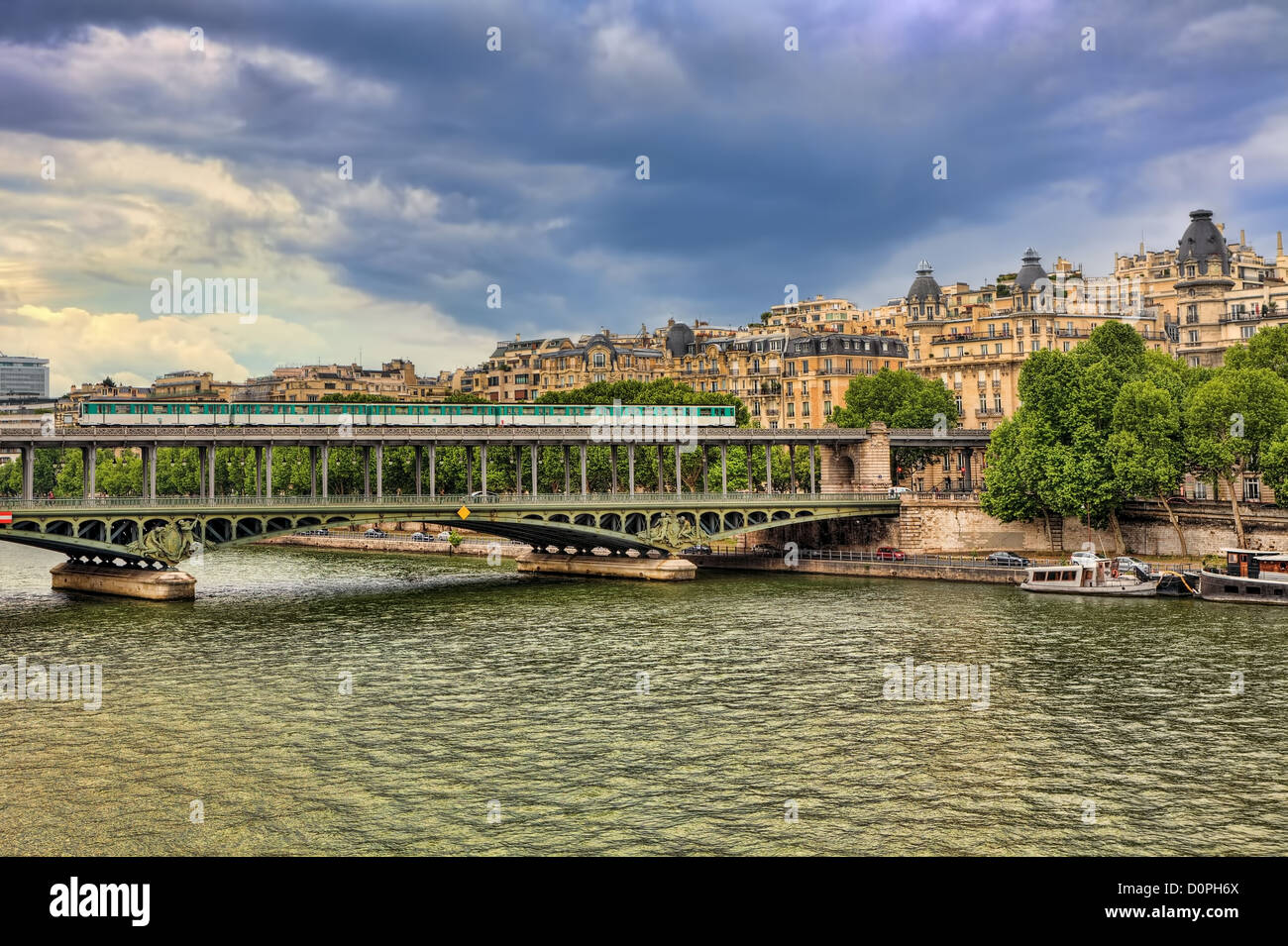 Train passing on famous Pont de Bir-Hakeim bridge over Seine River in ...