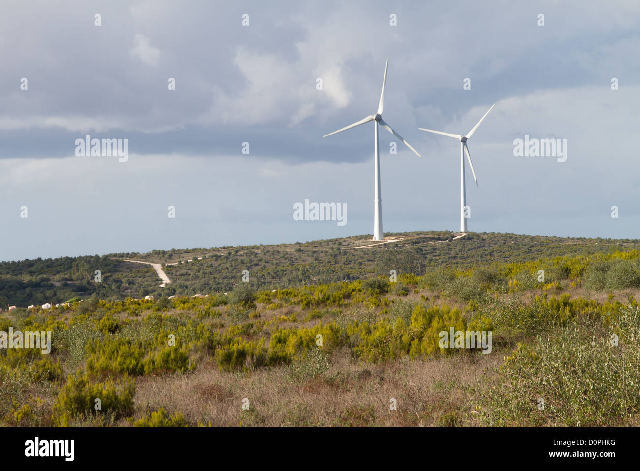 sunlit eolic blades on a hill Stock Photo - Alamy