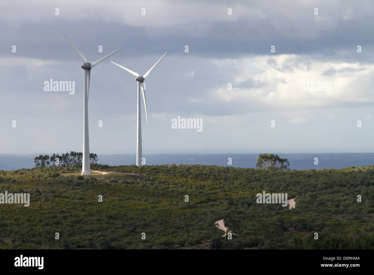 sunlit eolic blades on a hill Stock Photo - Alamy