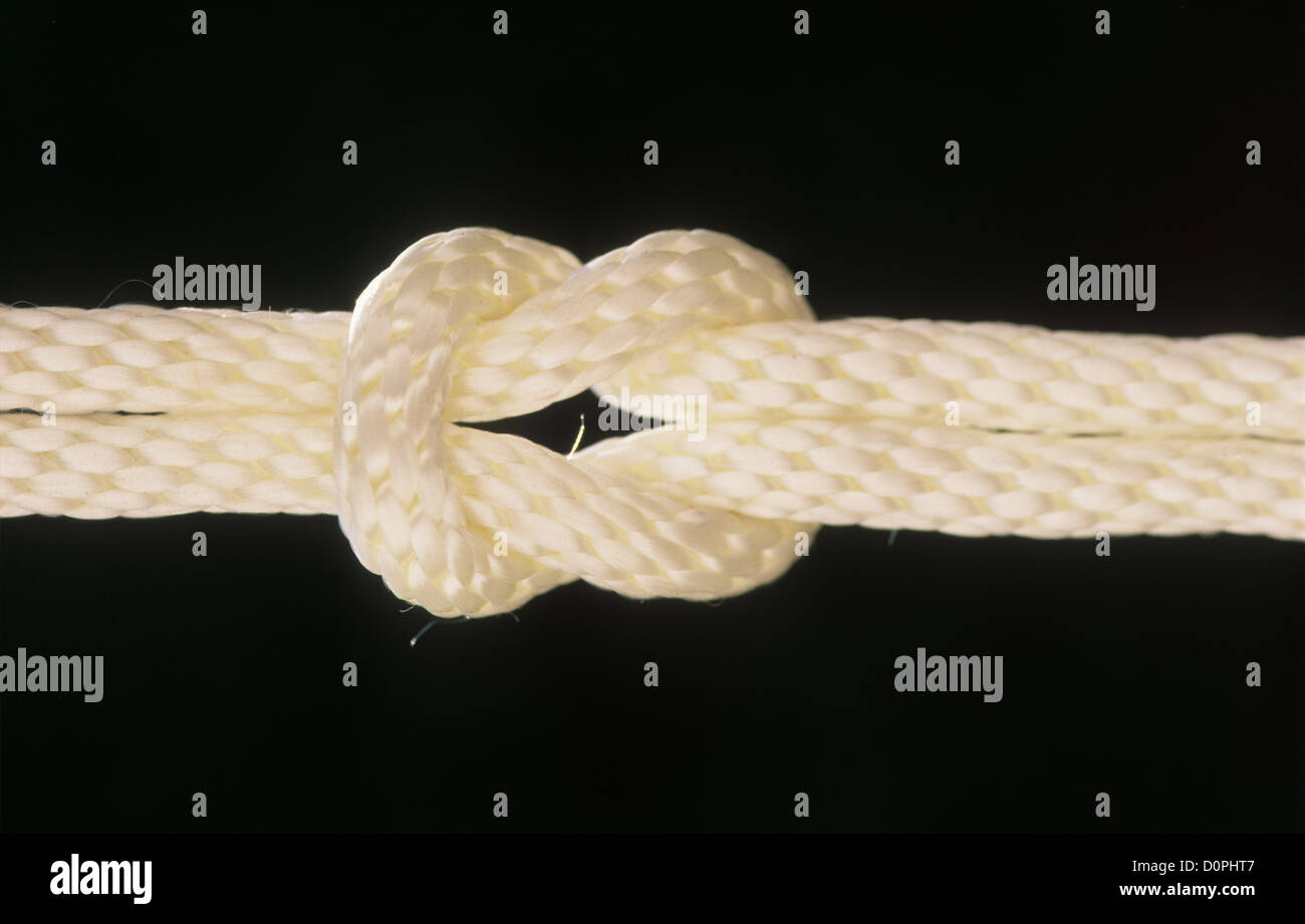 Knotted rope - reef knot Stock Photo - Alamy