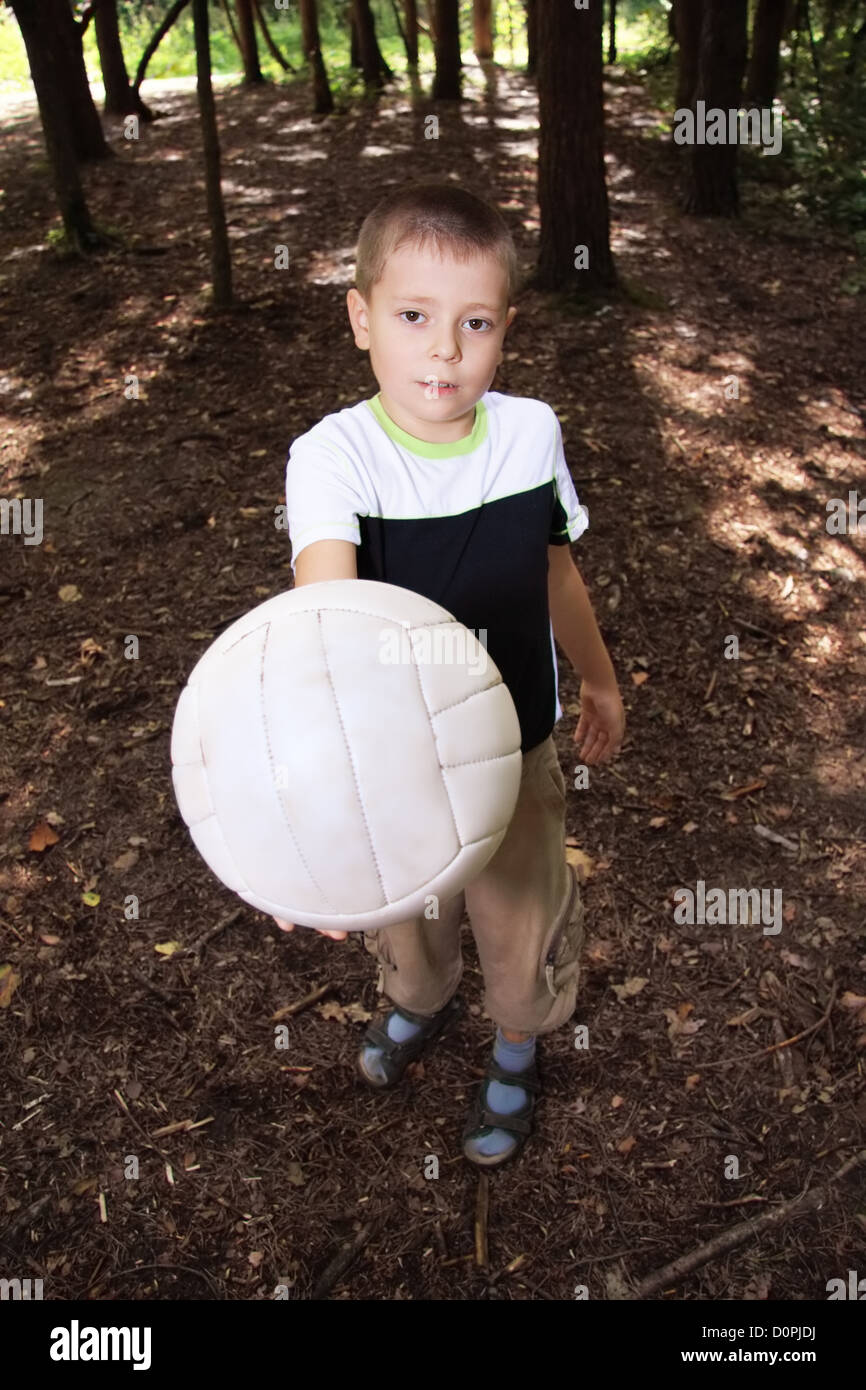 Boy giving ball Stock Photo - Alamy
