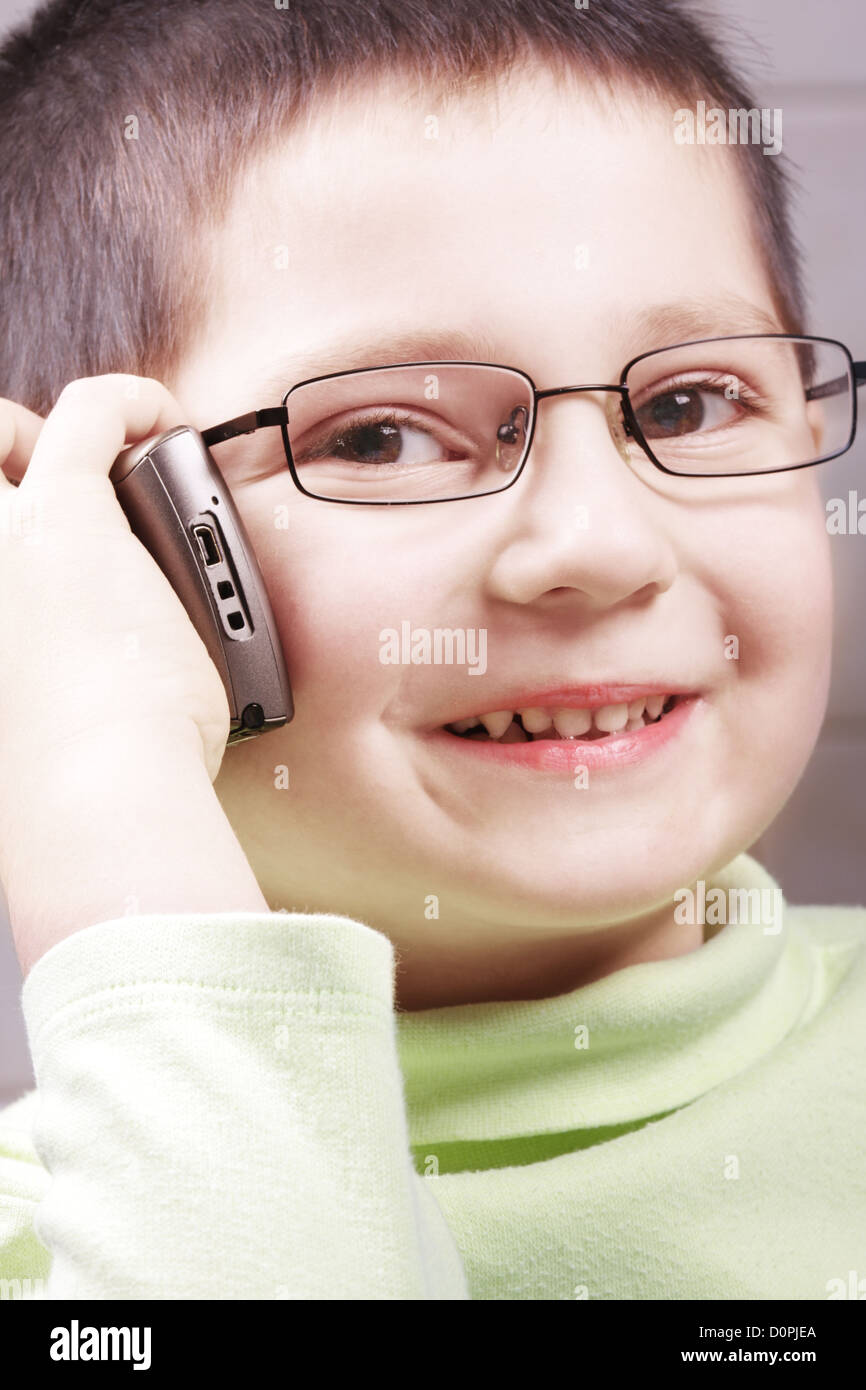 Smiling boy with cell phone Stock Photo - Alamy