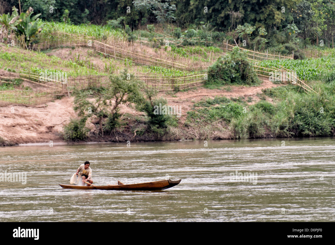 Fisherman With Net On Nam Ou River Nong Khiaw Laos // NONG KHIAW, Laos ...