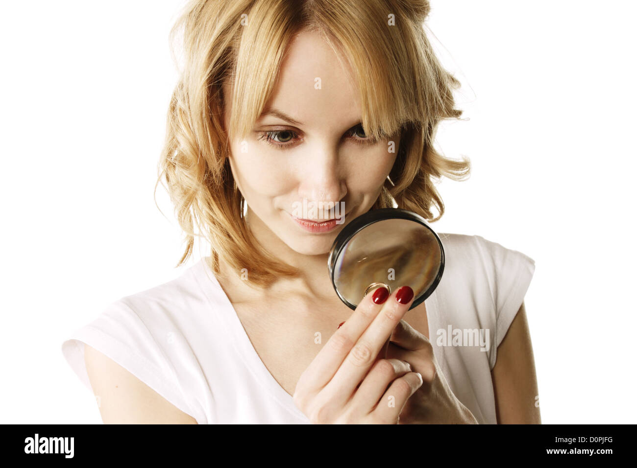 Blonde examining ring Stock Photo - Alamy