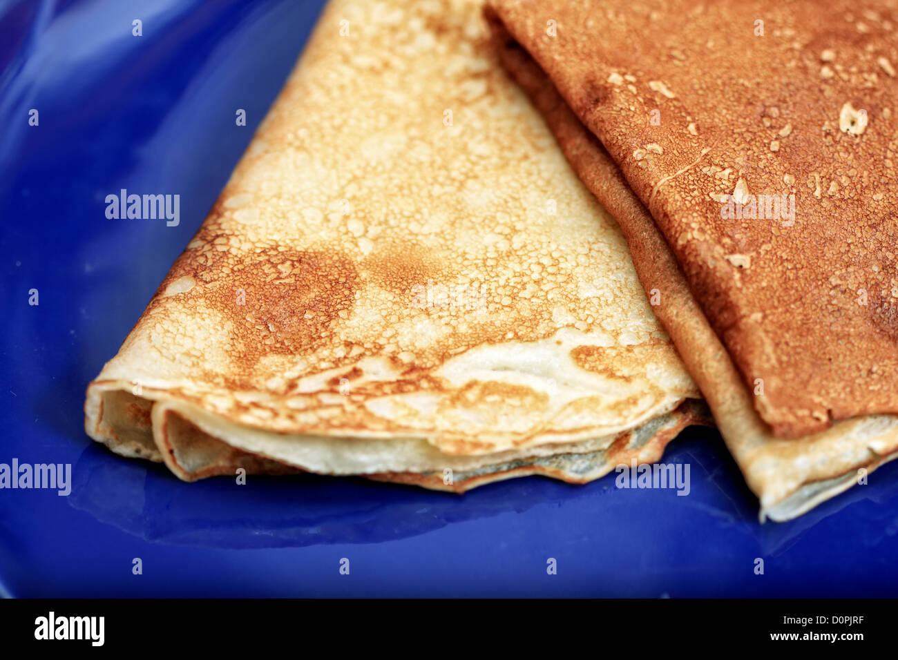 Pancake on blue plate hi-res stock photography and images - Alamy