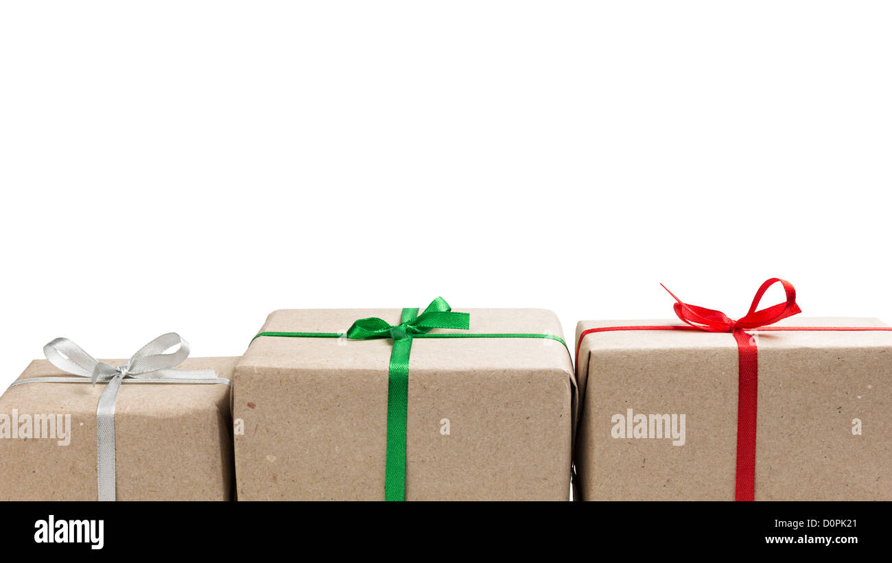 three gift boxes in a row isolated on white Stock Photo - Alamy