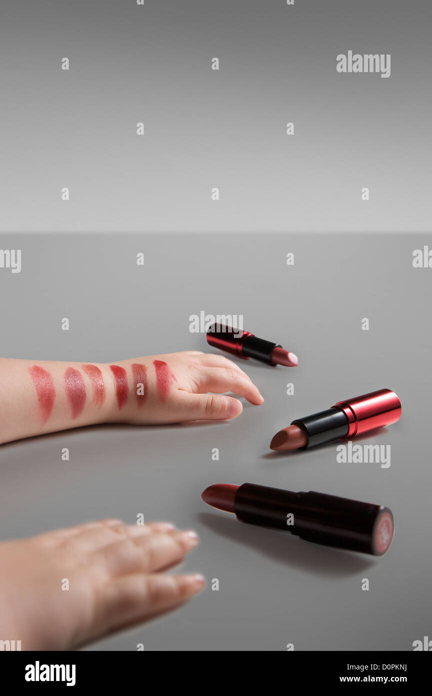 Child's hand, makeup, child testing, studio shot, lip stick Stock Photo ...