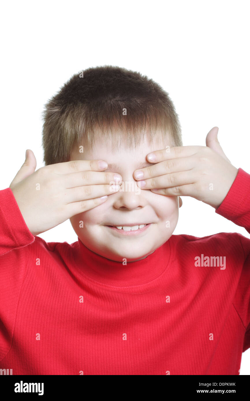 Smiling boy in red shutting eyes Stock Photo - Alamy
