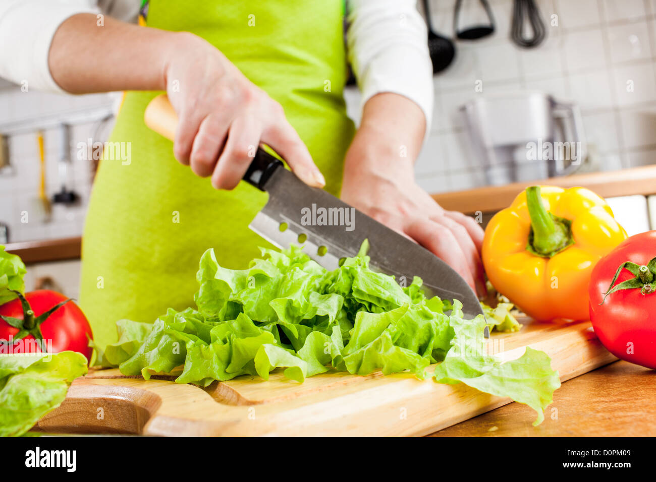 Woman's hands cutting vegetables Stock Photo - Alamy