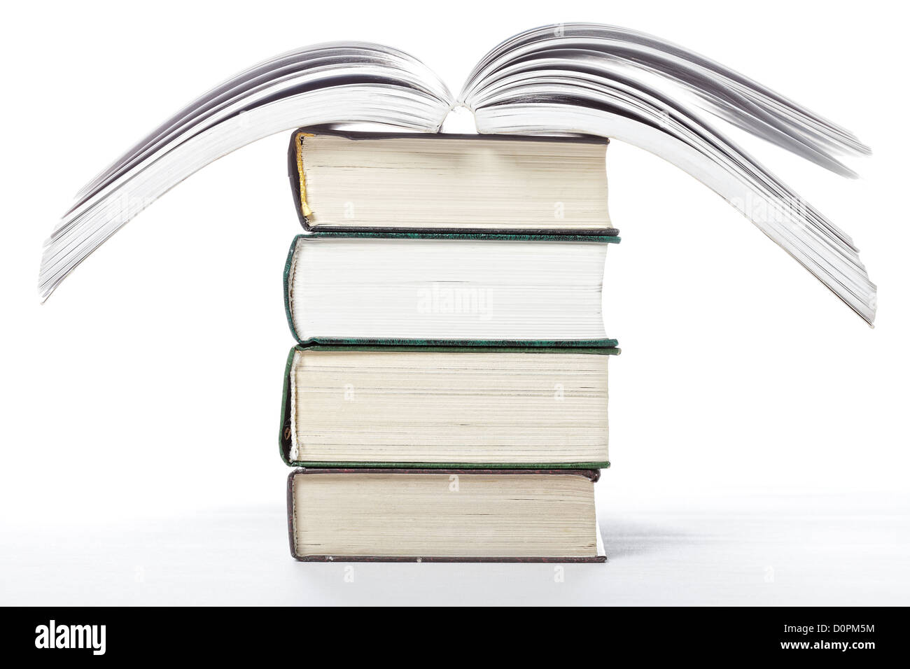 Open book on stack Stock Photo - Alamy