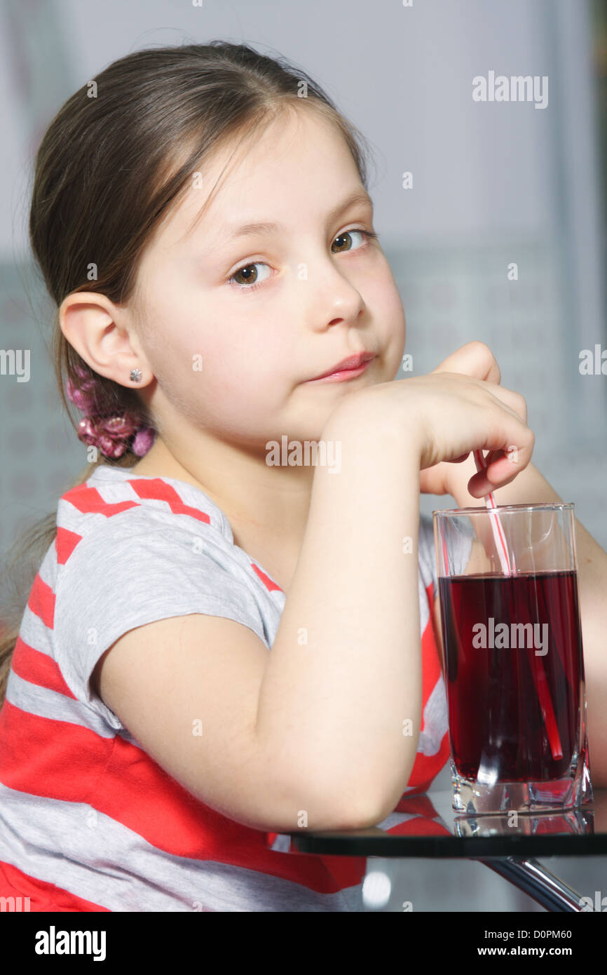 Cute girl with juice Stock Photo - Alamy