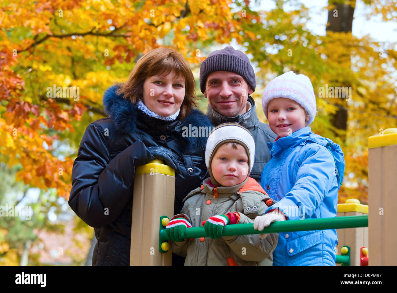 Family in autumn park Stock Photo - Alamy