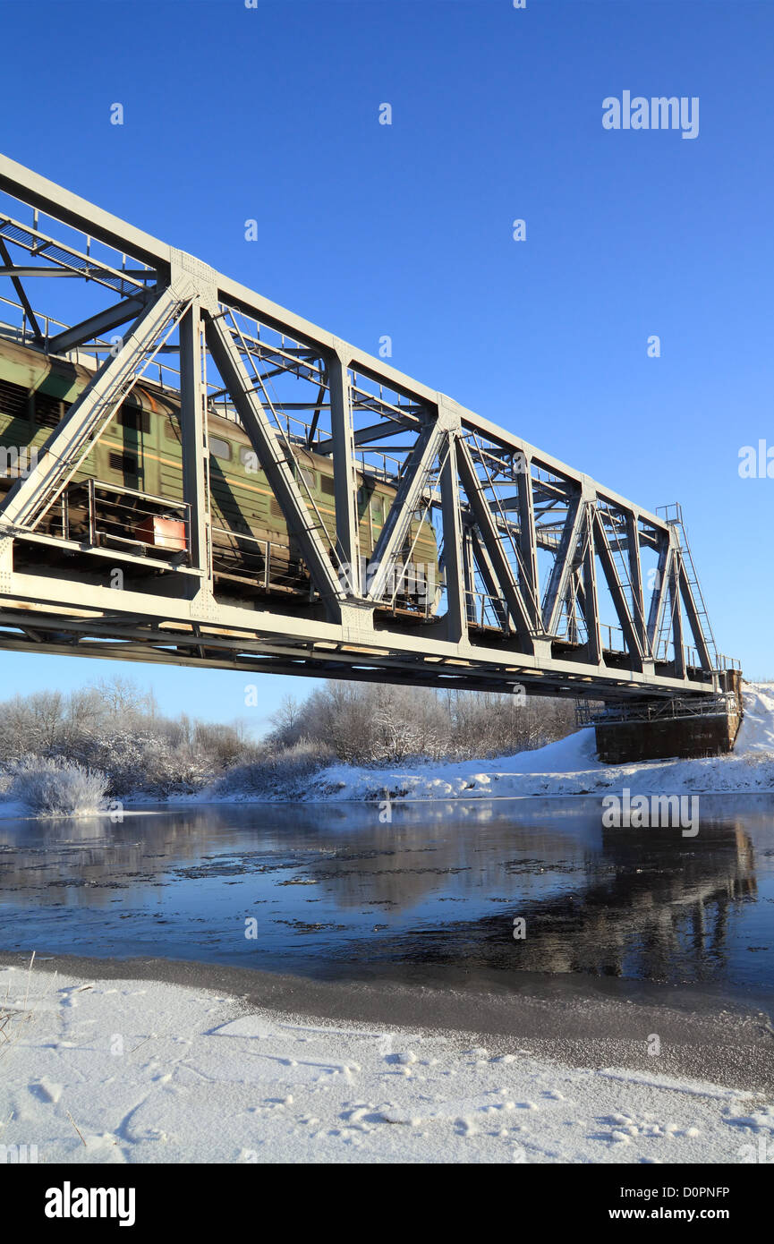 railway bridge through small river Stock Photo - Alamy