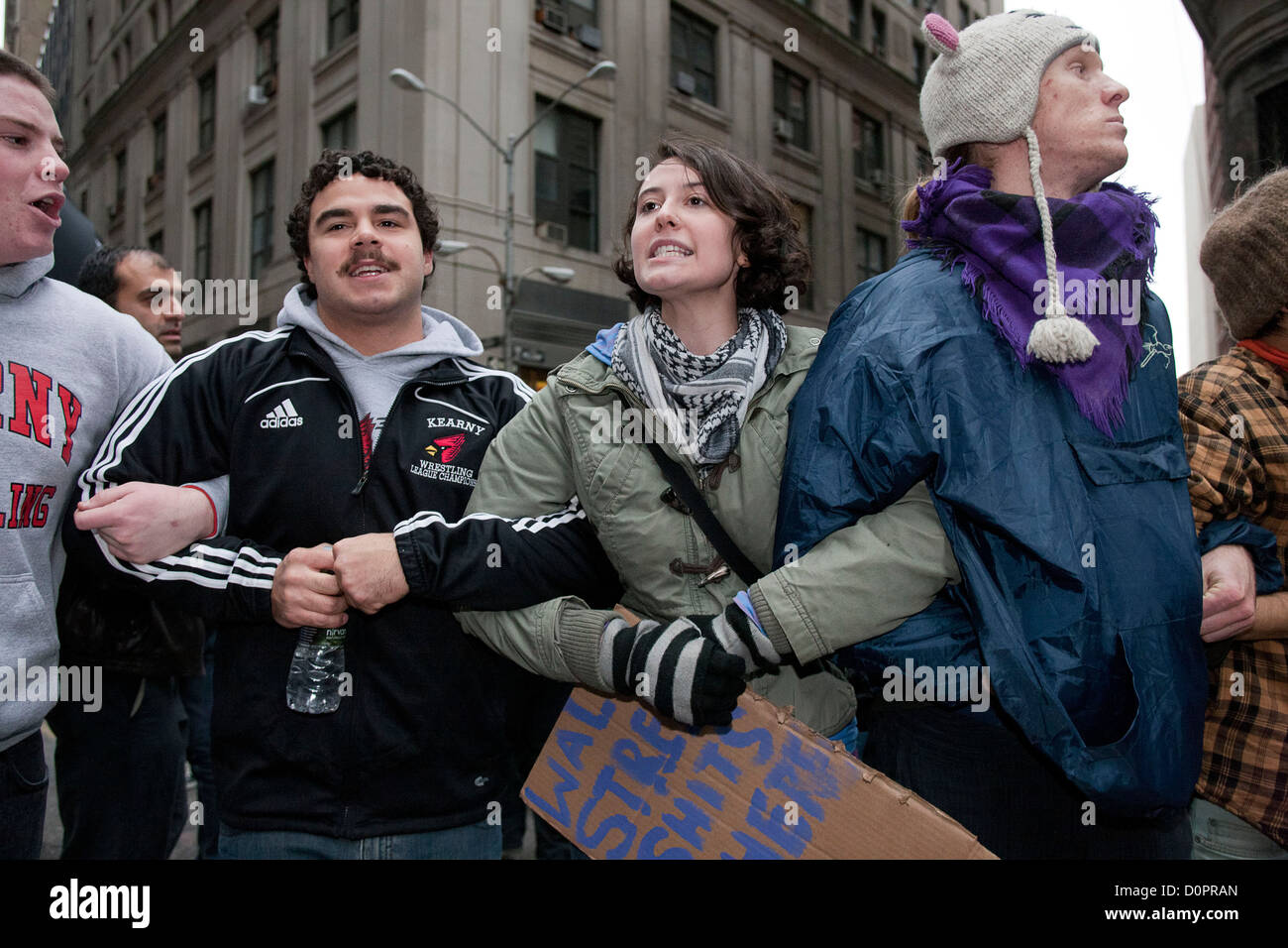 Occupy Wall street protesters demonstrating on Wall Street in New York ...