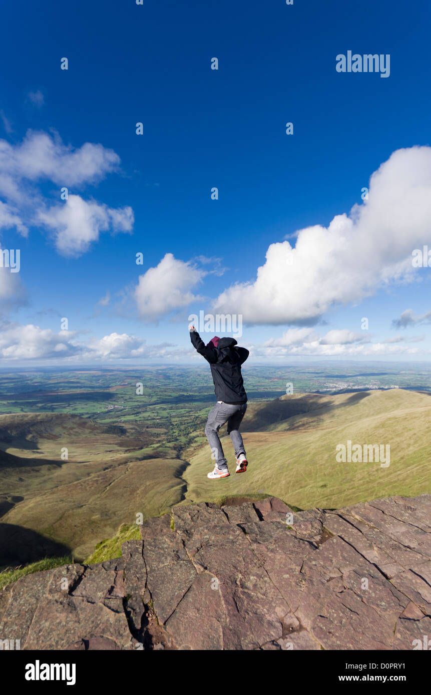 Man (giving the appearance of) jumping from the top of Corn Du, near ...