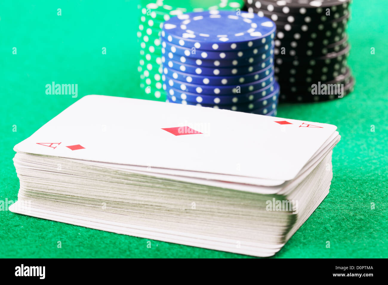 Card deck with chips behind Stock Photo - Alamy