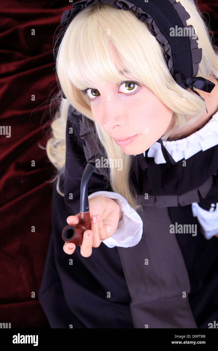 Beautiful cosplay young woman with a pipe Stock Photo - Alamy