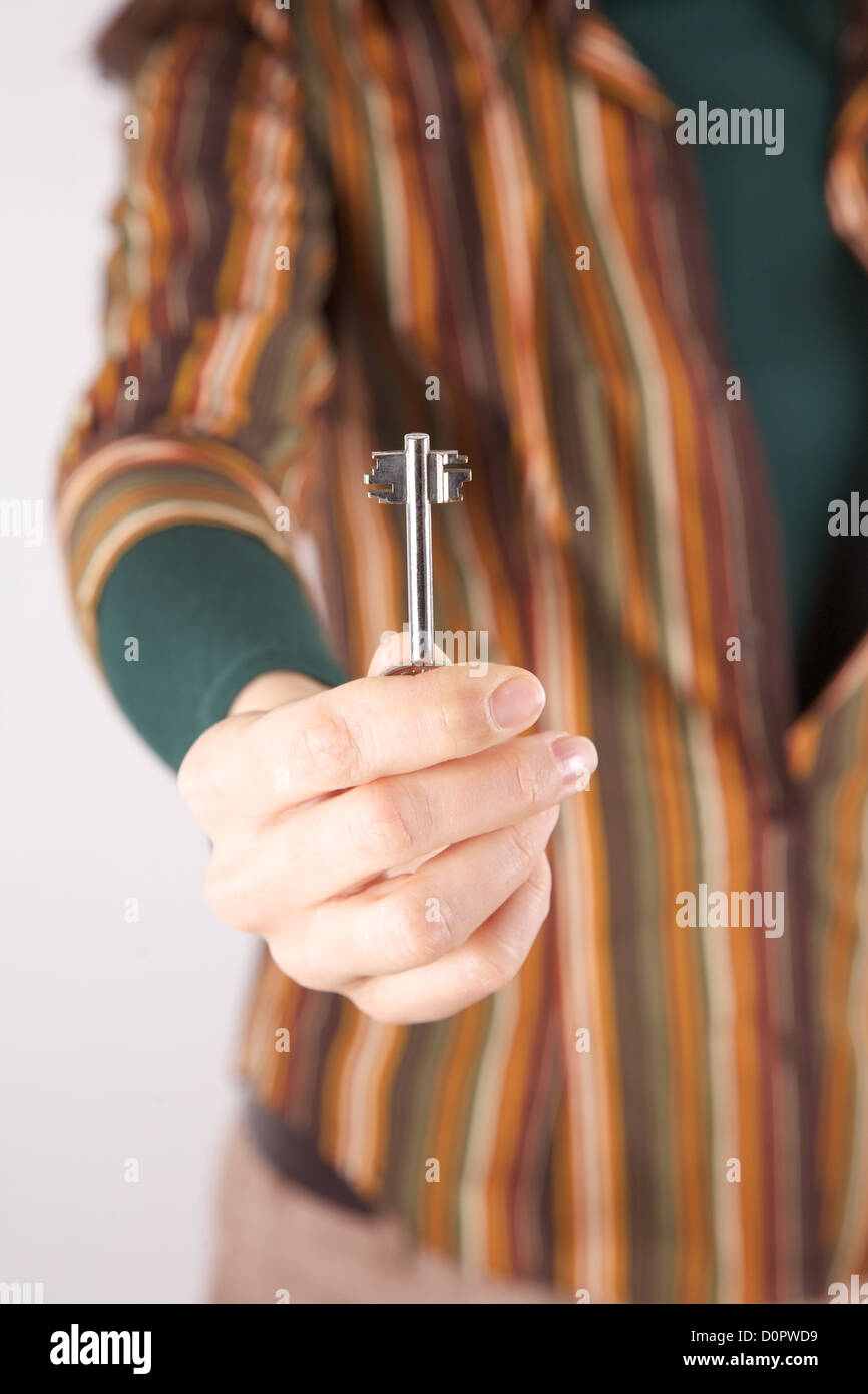 woman detail holding a key in her hand Stock Photo - Alamy