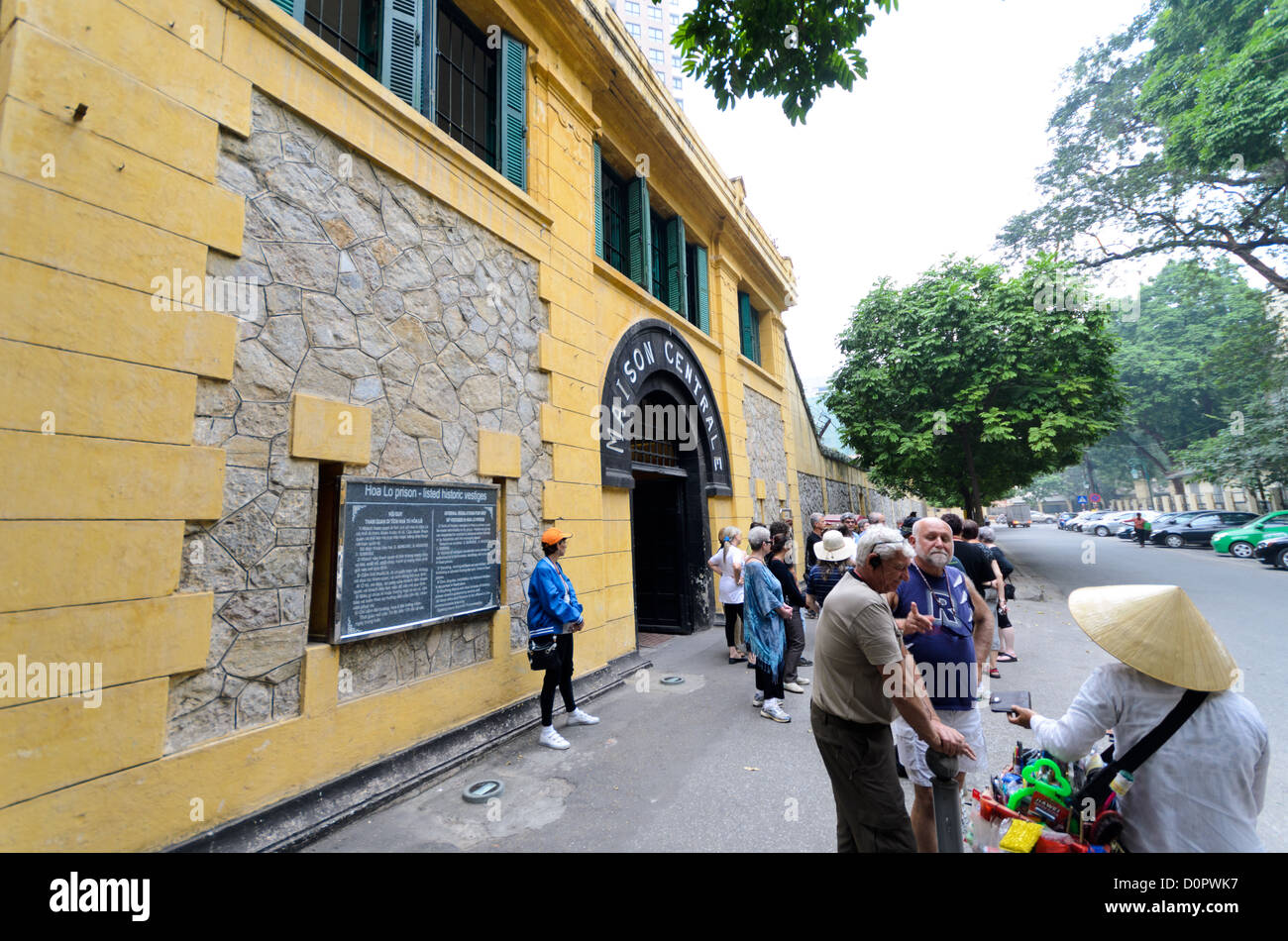 Hoa Lo Prison Entrance Hanoi Vietnam // HANOI, Vietnam — Visitors stand ...