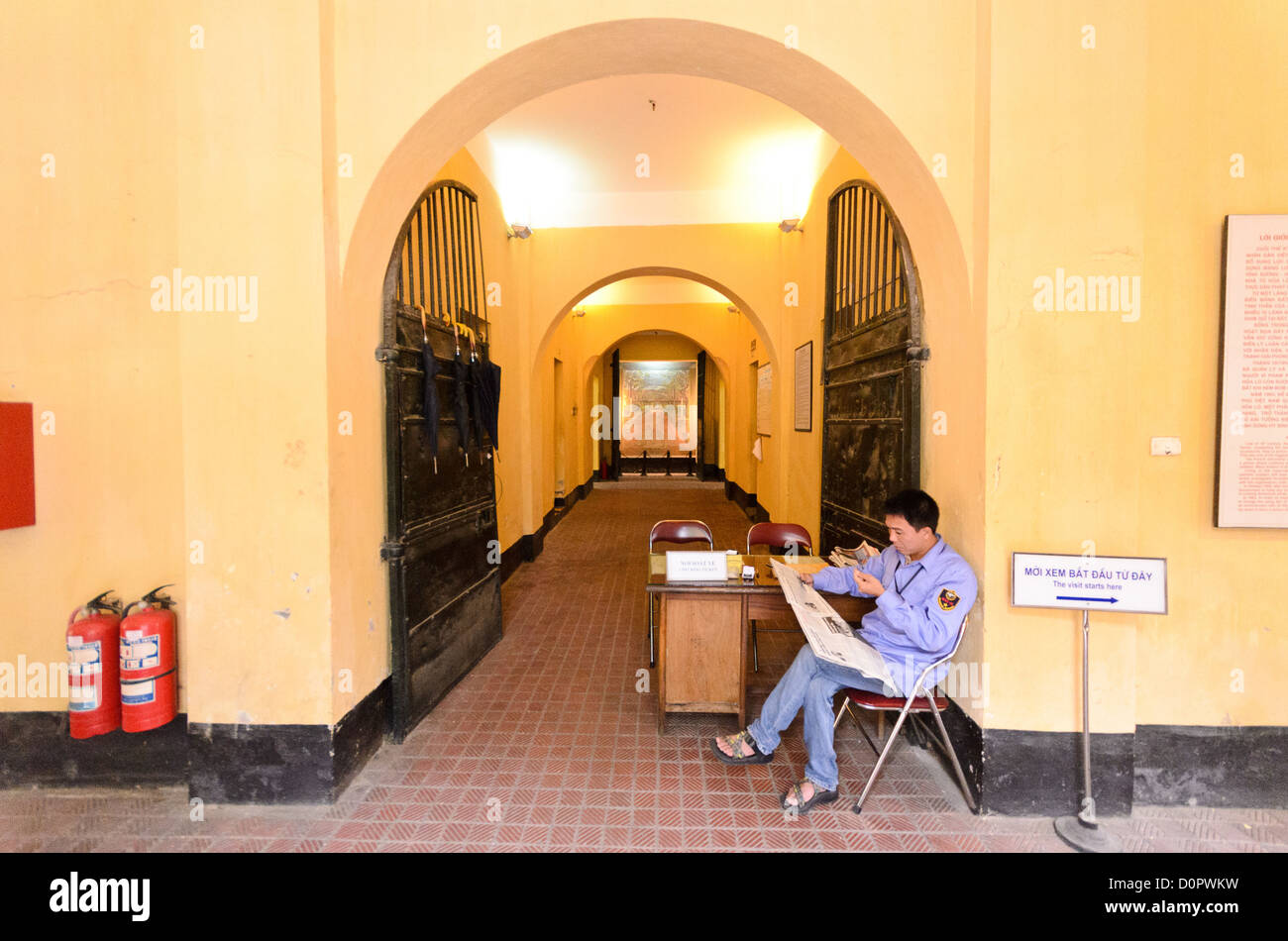 HANOI, Vietnam — A guard sits at the main entrance of Hoa Lo Prison ...