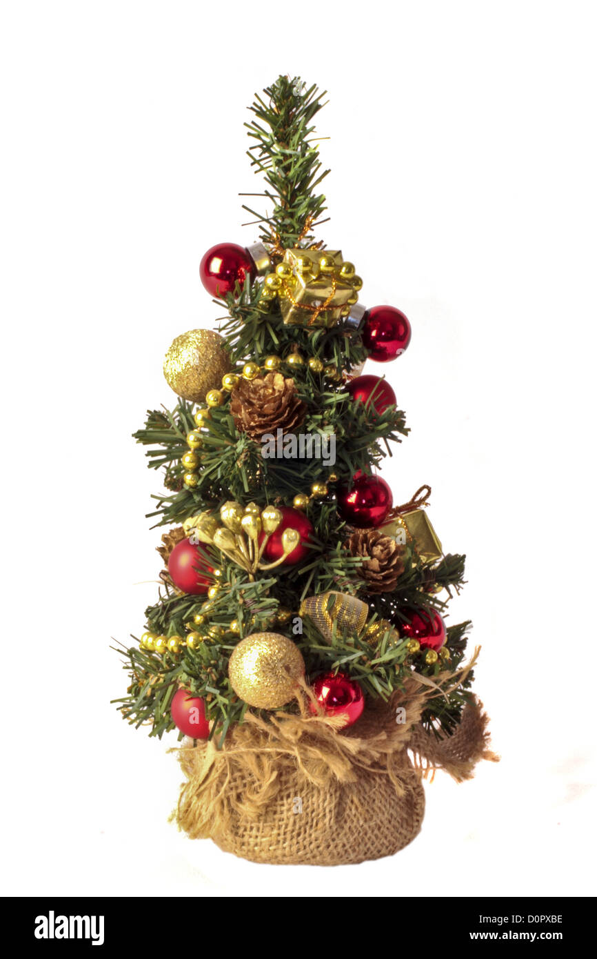 Cute little christmas tree with ornaments and presents isolated on ...