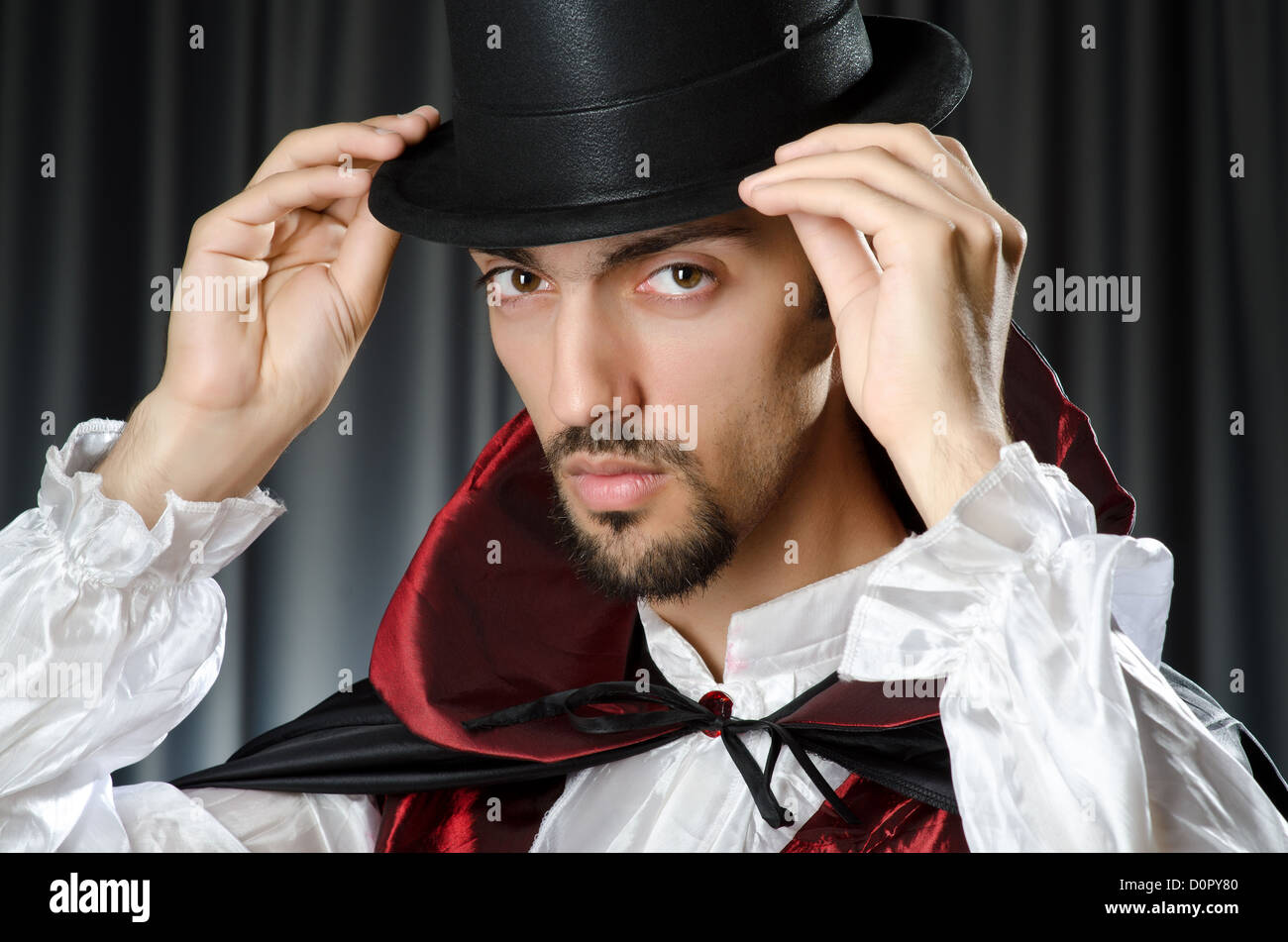Magician doing tricks hi-res stock photography and images - Alamy