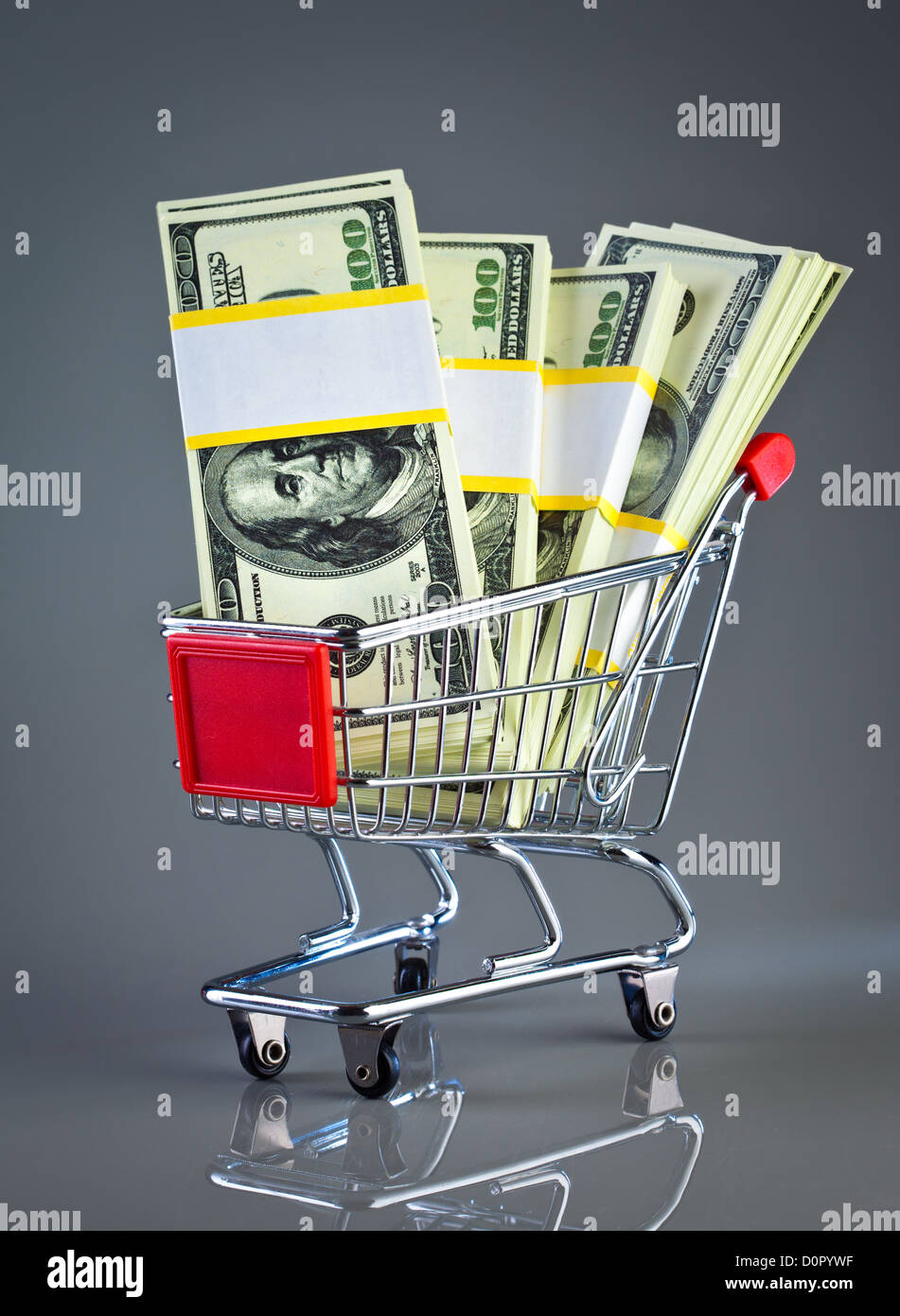 shopping cart and money Stock Photo - Alamy