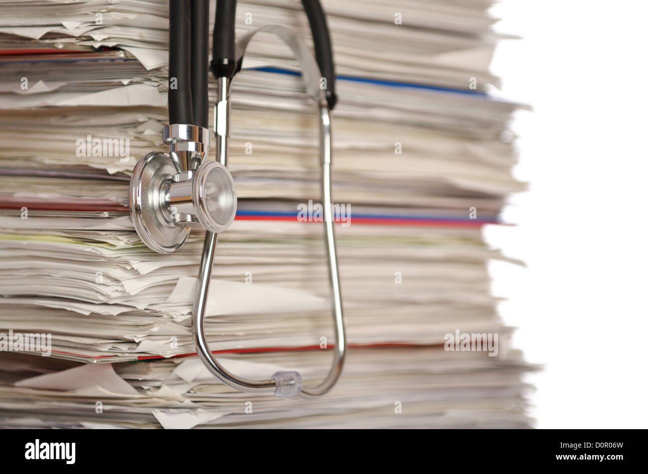 Stack of papers with stethoscope Stock Photo - Alamy