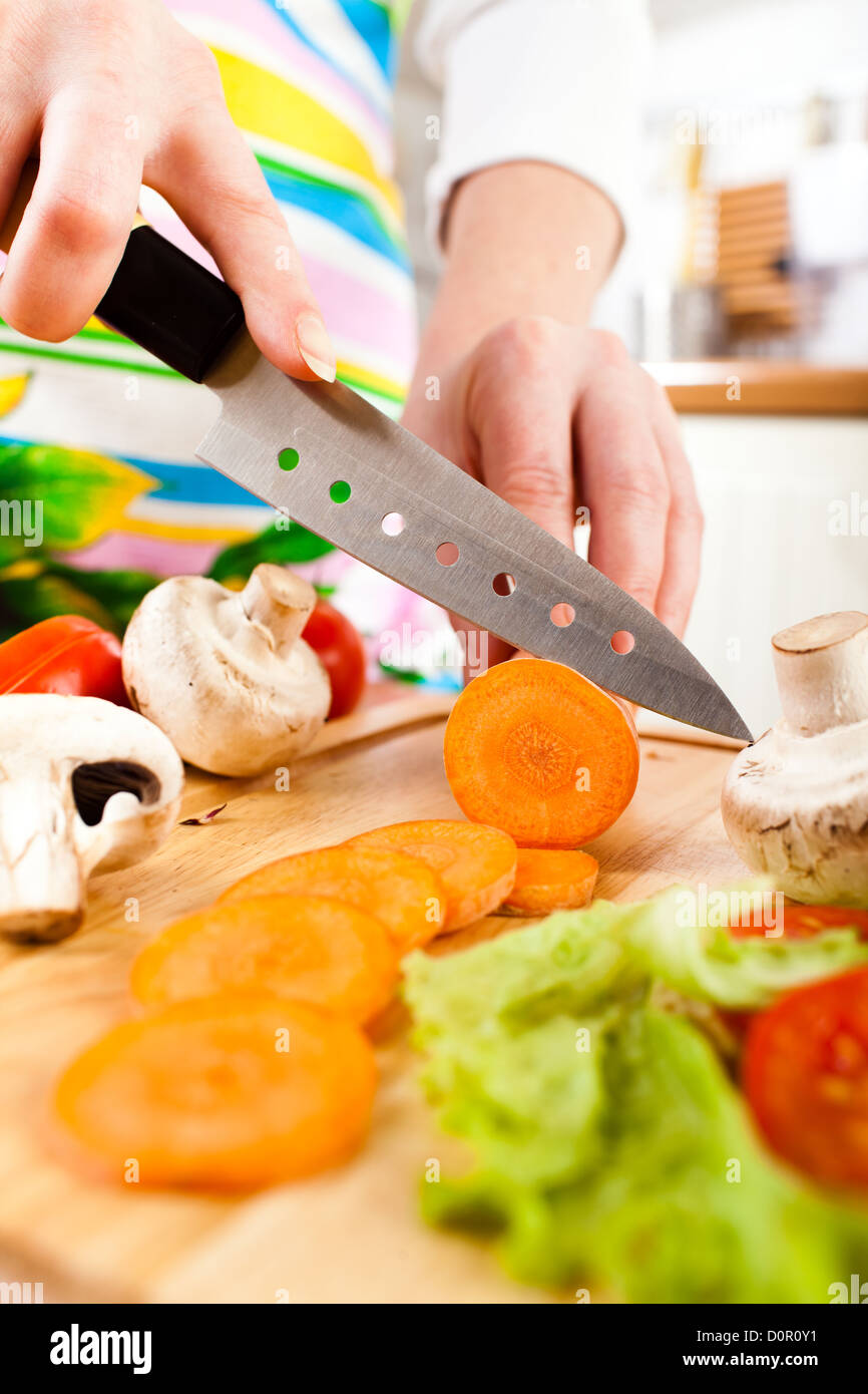 Woman's hands cutting vegetables Stock Photo - Alamy