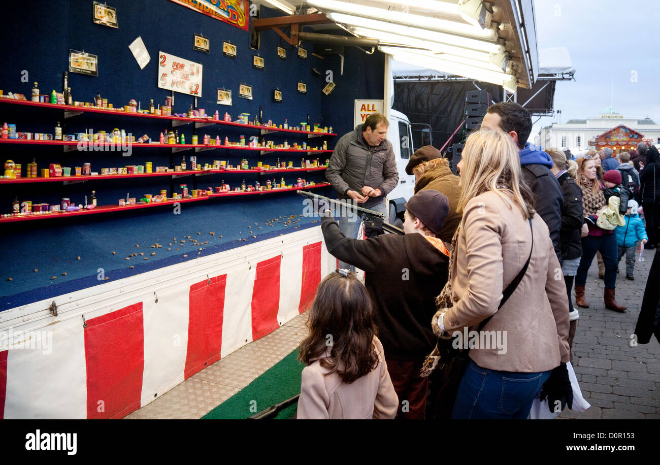 Fairground game child rifle shooting with family, Bury St Edmunds ...