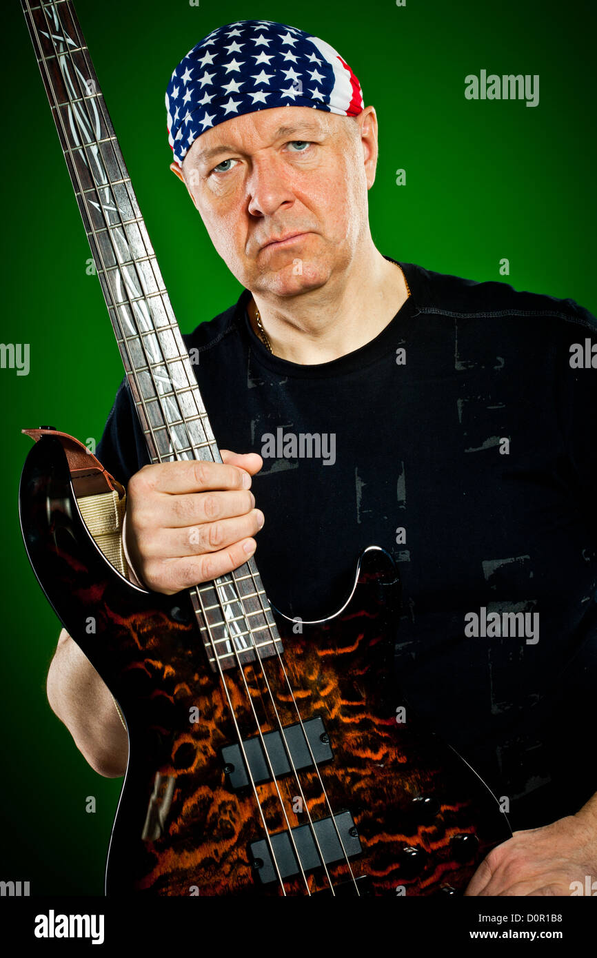 man with a guitar, bass player Stock Photo - Alamy